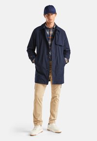 United Colors of Benetton LONG BUTTON AND FLY CLOSURE WELT POCKETS FLAP ...