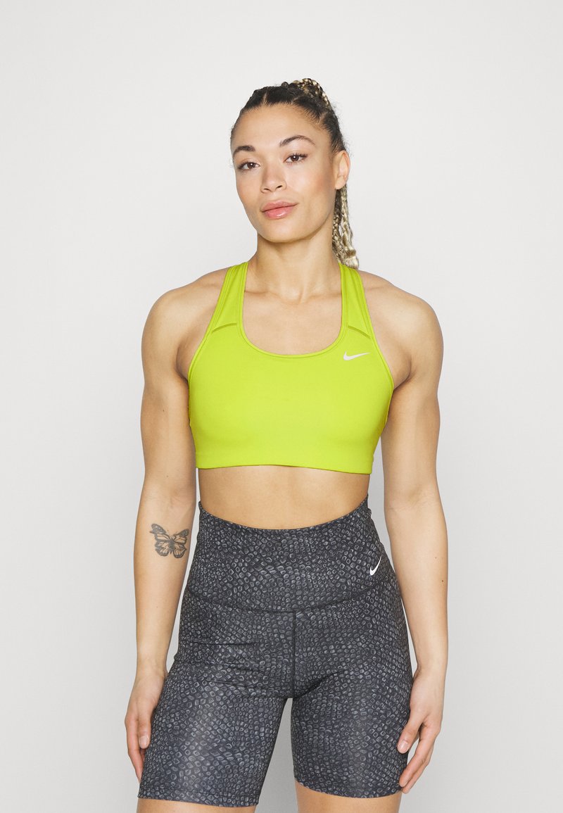 Nike Performance BRA - Sport-BH med medium stöd - bright cactus/white ...