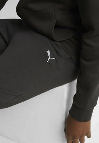 Puma TECH - Trainingsbroek - black/zwart - Zalando.nl