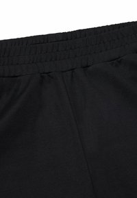 HUGO NELEGA - Pantalon de survêtement - black one/noir - ZALANDO.FR