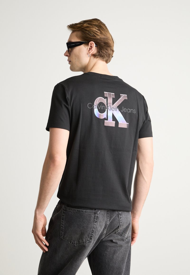 Calvin Klein Jeans EUPHORIC MONOLOGO TEE - Print T-shirt - black - Zalando.ie