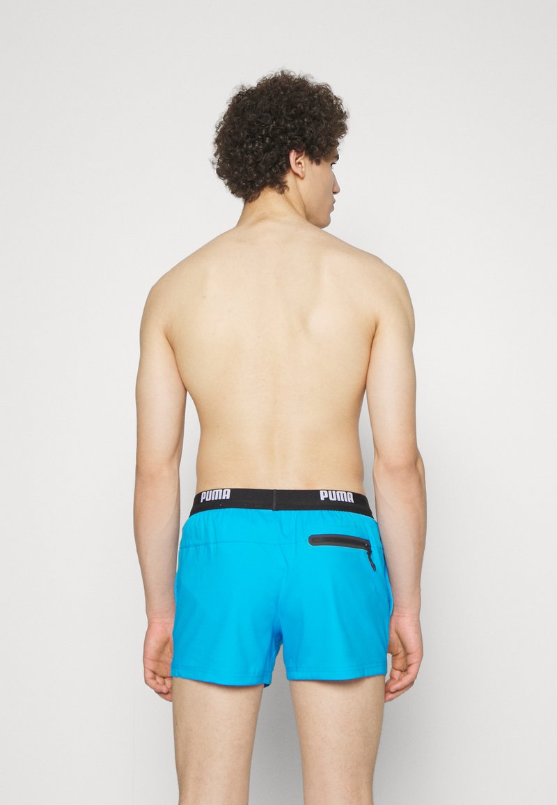 Puma SWIM MEN LOGO LENGTH SWIM SHORTS - Swimming shorts - energy blue ...