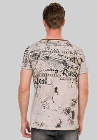 Rusty Neal T-Shirt print - stone/grau - Zalando.de
