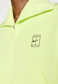 Nike Performance NIKECOURT ADVANTAGE JACKET - Felpa con zip - lemon ...