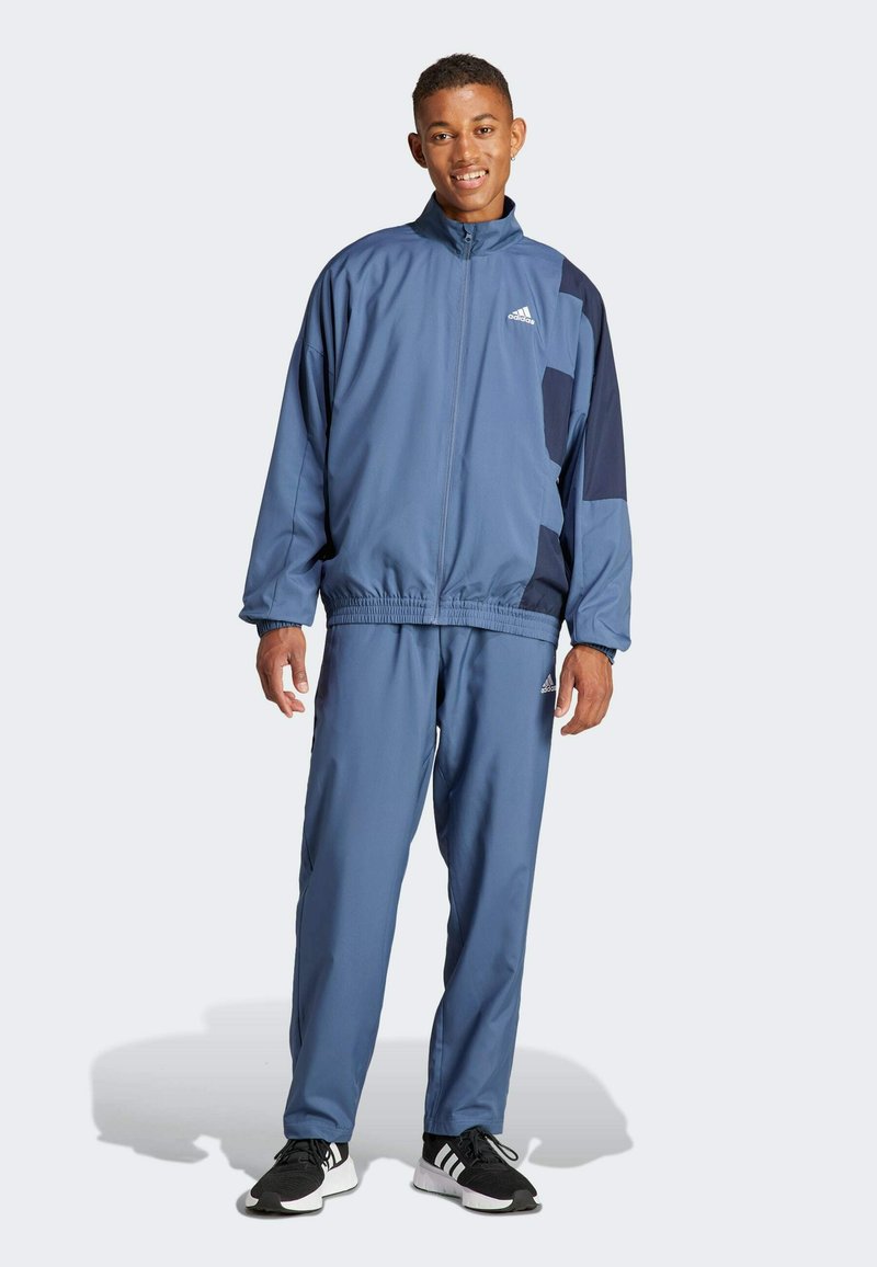 adidas Sportswear COLORBLOCK - Tracksuit - preloved ink legend ink/blue ...