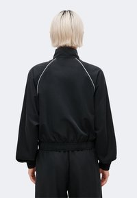 Lacoste Sport Training jacket - black/white/black - Zalando