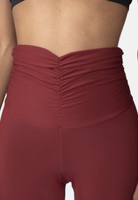 Flavia Valentini THERMAL - Leggings - Hosen - dark red/cognac - Zalando.de