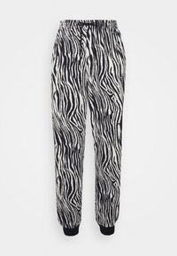 adidas Originals ALLOVER ZEBRA - Tracksuit bottoms - cloud white/black ...