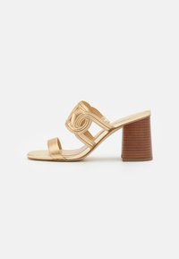 MICHAEL Michael Kors ALMA - Mules à talons - pale gold/doré - ZALANDO.CH