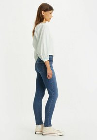 Levi's® 721™ HIGH RISE SKINNY - Jeans Skinny Fit - blue wave mid med ...