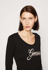 Guess SCRIPT - Langarmshirt - black/schwarz - Zalando.ch