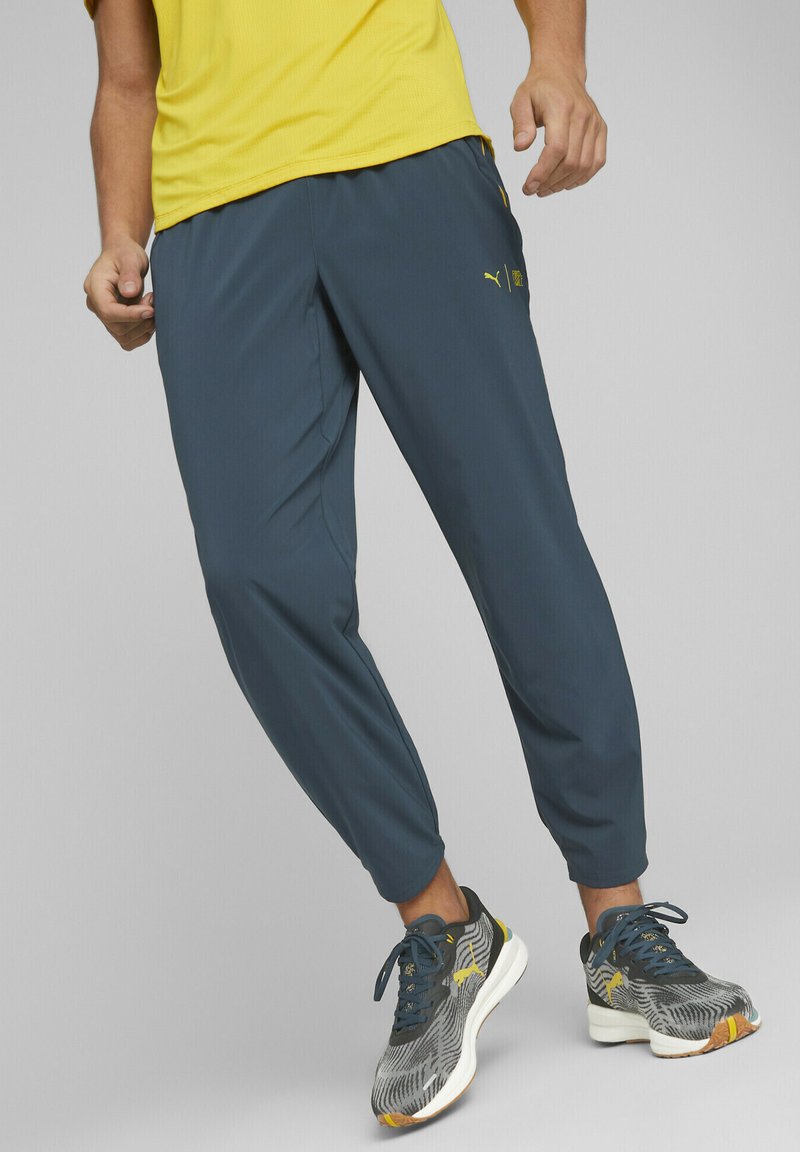 Puma X FIRST MILE RUNNING TRAININGS - Tracksuit bottoms - dark night ...