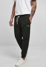 Starter STARTER CIRCLE - Tracksuit bottoms - black - Zalando.co.uk