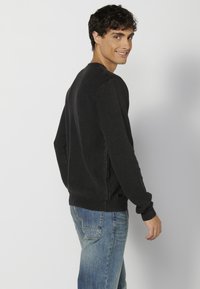 Koroshi Strickpullover - black/schwarz - Zalando.de
