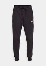 Diesel Tracksuit bottoms - black - Zalando.co.uk