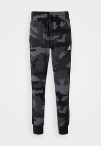 adidas Sportswear SEASONAL ESSENTIALS CAMOUFLAGE - Tracksuit bottoms ...