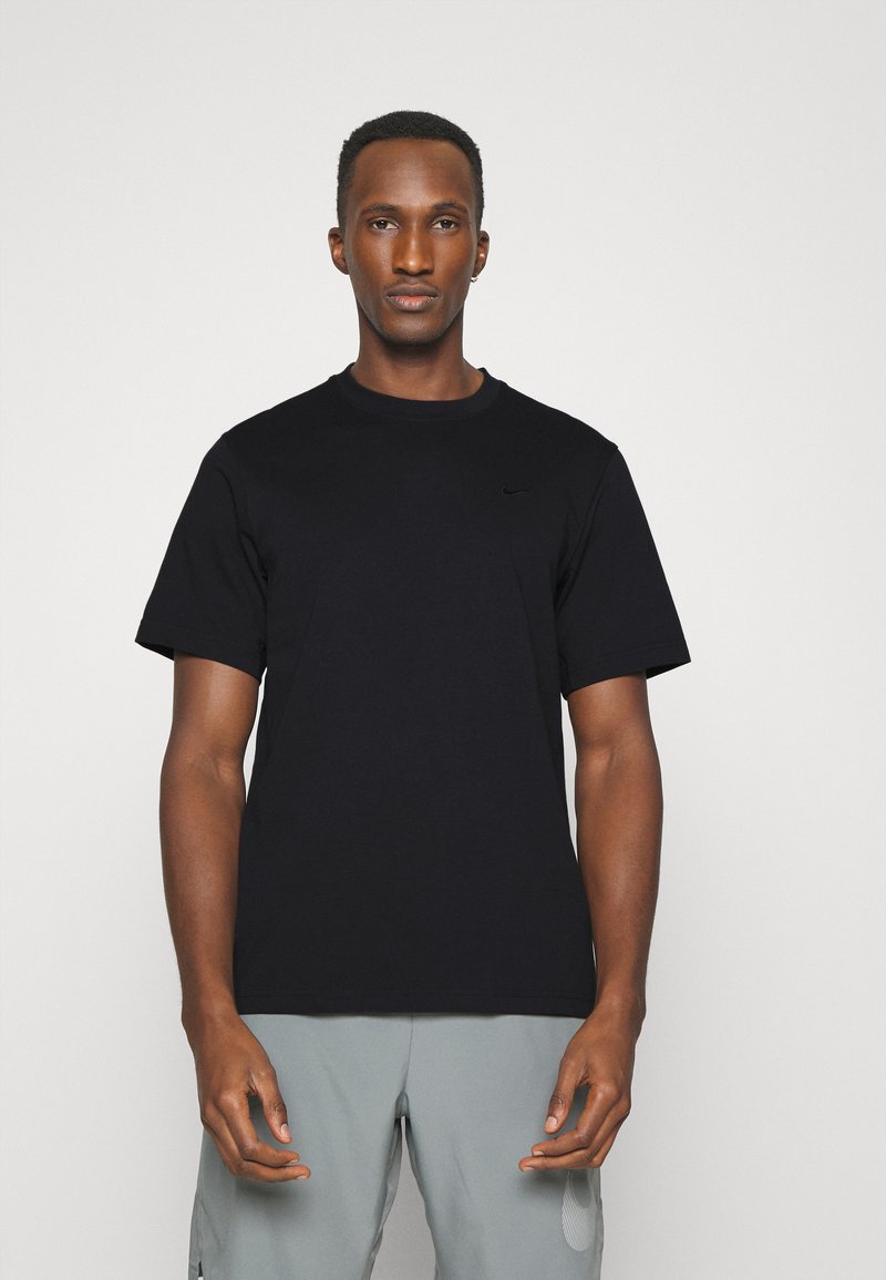 Nike Performance PRIMARY - Sports T-shirts - black/sort - Zalando.dk