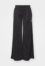 Puma CLASSICS LOW RISE POPPER PANTS - Tracksuit bottoms - black ...