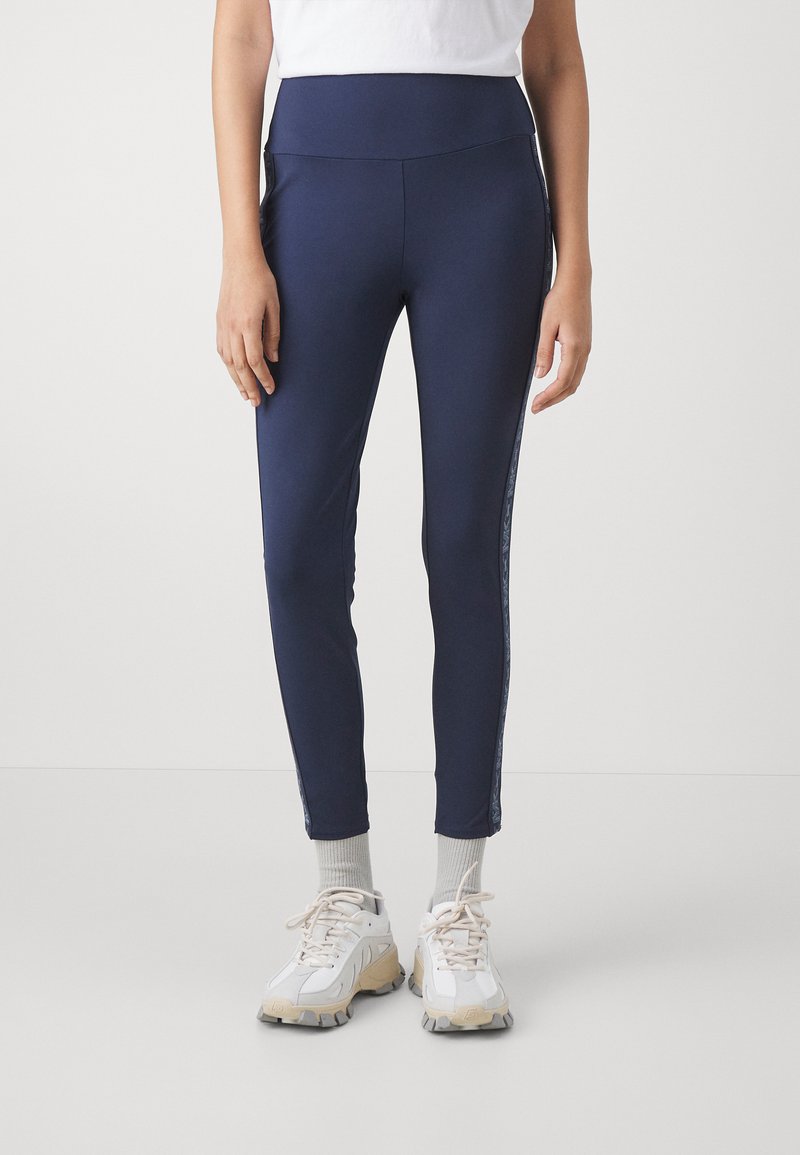 MICHAEL Michael Kors LOGO TAPE - Leggings - Trousers - midnight blue ...