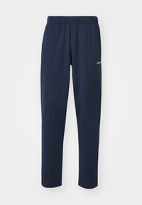 adidas Originals FIRST - Tracksuit bottoms - night indigo/dark blue ...