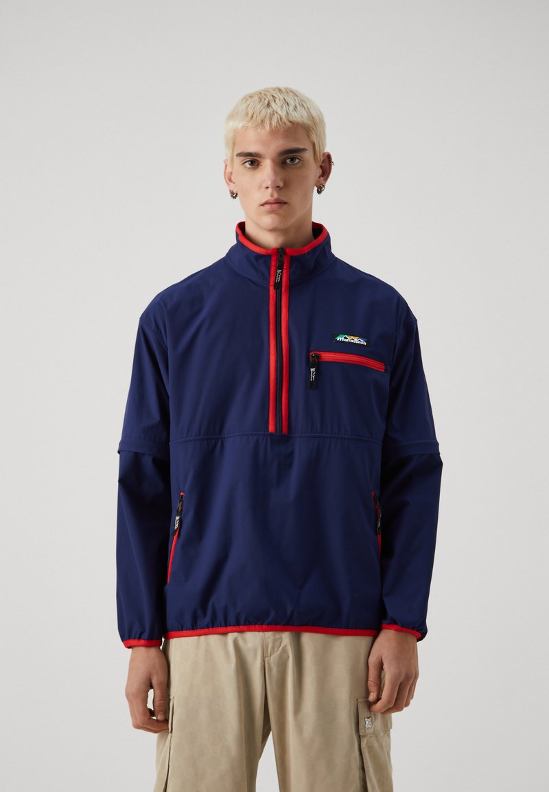 Manastash POPPY POP OVER 24 UNISEX - Jachetă de vânt - navy/bleumarin ...