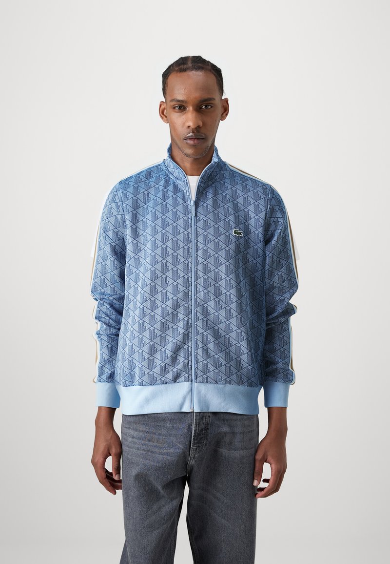 Lacoste MONOGRAM TRACK JACKET - Trainingsjacke - rill/globe/blau ...