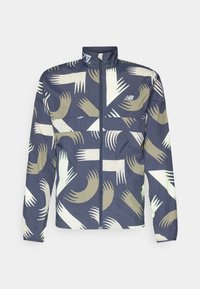 New Balance LONDON EDITION PRINTED ATHLETICS PACKABLE RUN JACKET ...