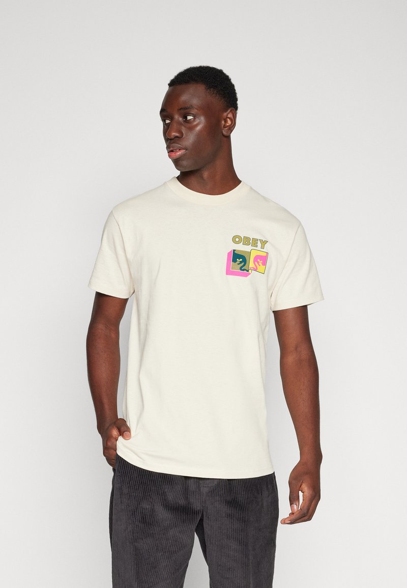 Obey Clothing POST MODERN UNISEX - Print T-shirt - cream/off-white - Zalando.ie