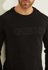 Guess FRONTLOGO - Sweater - schwarz/zwart - Zalando.nl