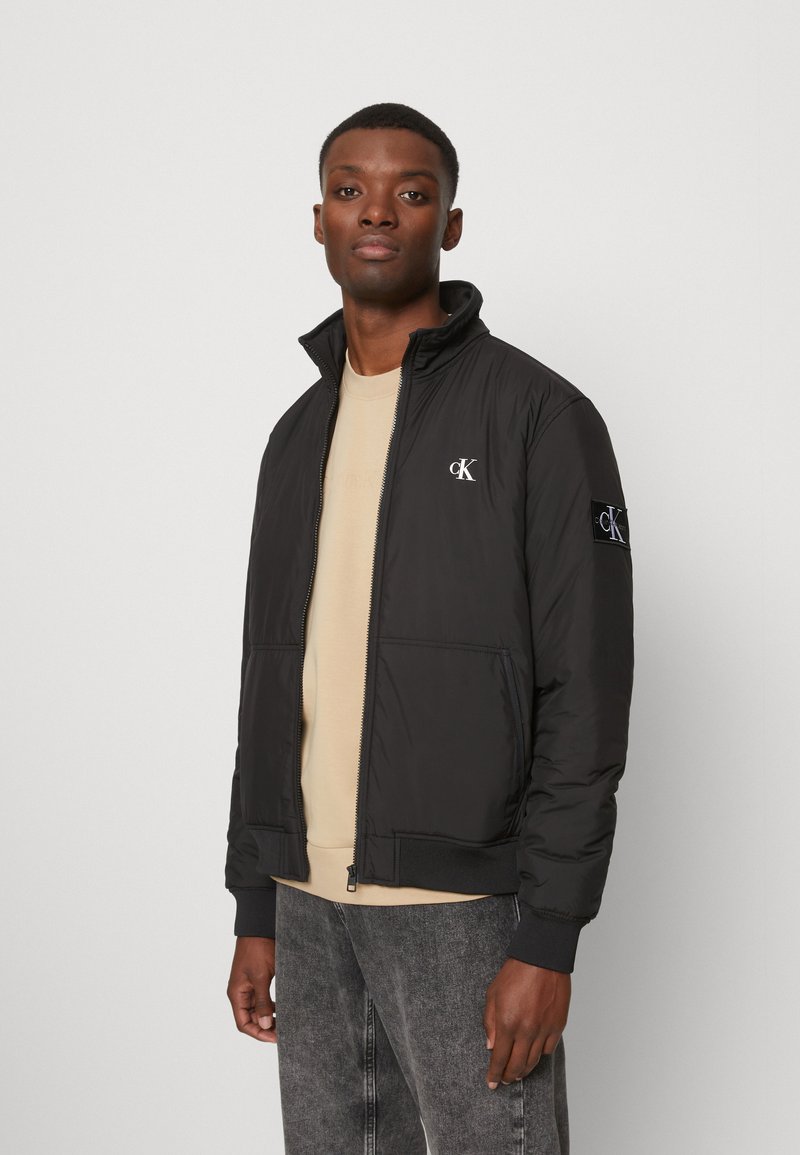 Calvin Klein Jeans PADDED HARRINGTON JACKET - Light jacket - black ...