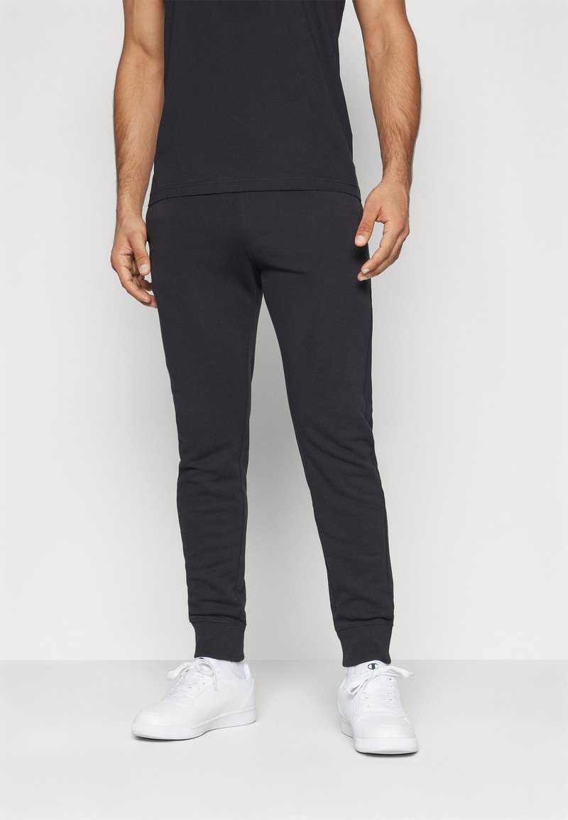 Champion ICONS CUFF PANT - Tracksuit bottoms - black - Zalando