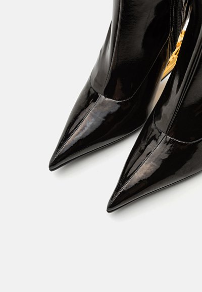 GCDS MORSO BOOTS - Botas de cuña - gold/negro - Zalando.es