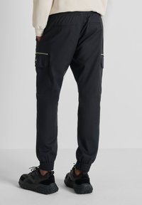 Antony Morato TONY REGULAR FIT WITH LOGOED BADGE - Cargo trousers ...
