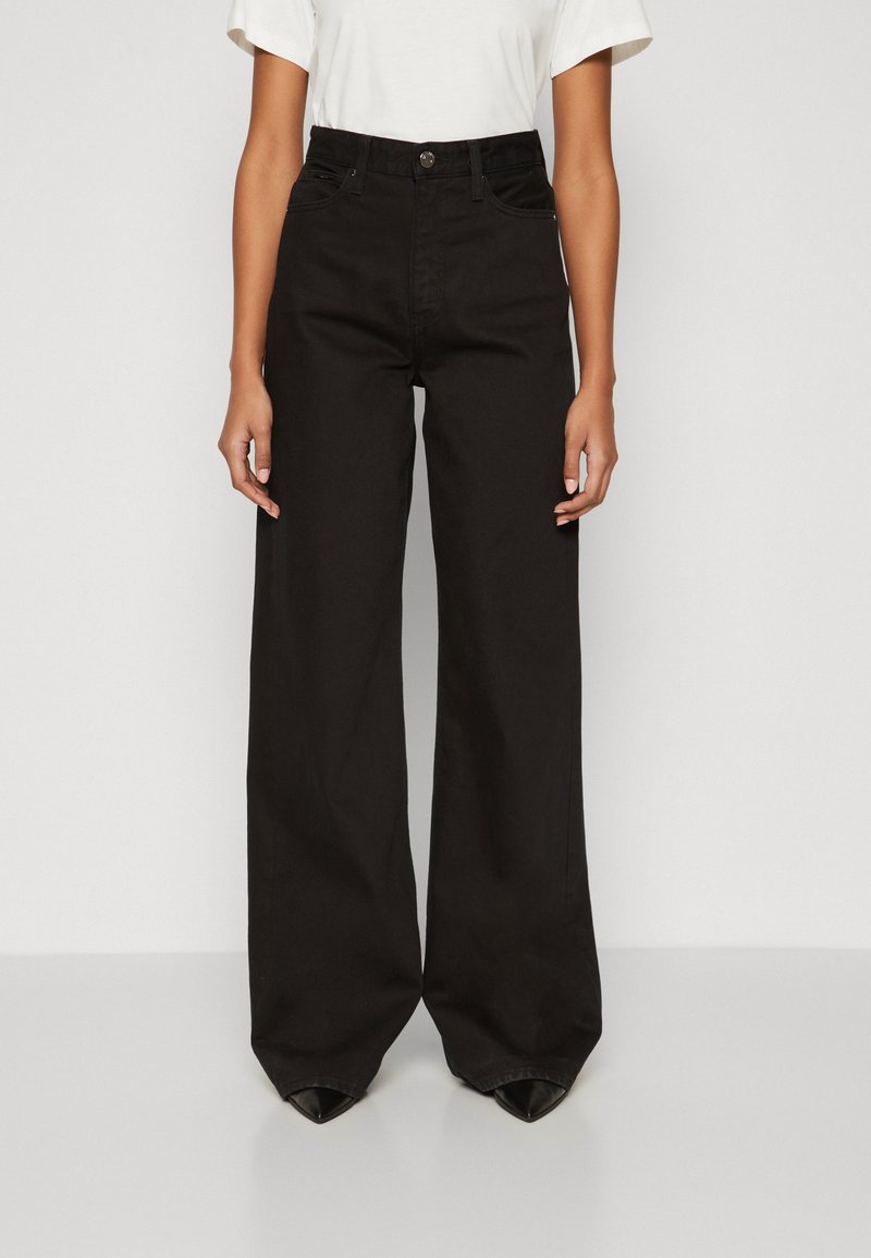 Calvin Klein HIGH RISE WIDE INFINITE - Pernera ancha - denim black ...