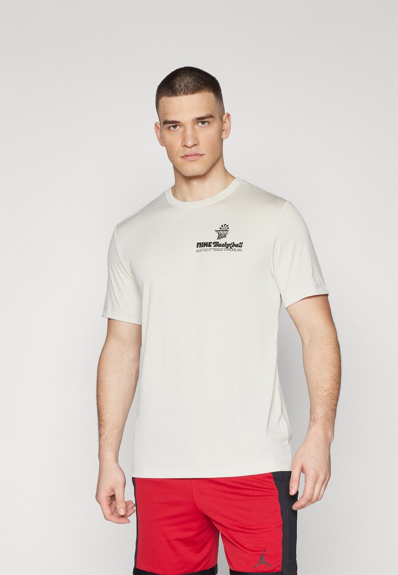 Nike Performance TEE - Sports T-shirt - light bone/beige - Zalando.ie