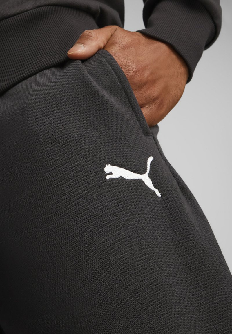 Puma DYLAN BASKETBALL - Tracksuit bottoms - black - Zalando.ie