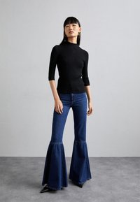 maje MANUCLOVER - Strickpullover - noir/schwarz - Zalando.at