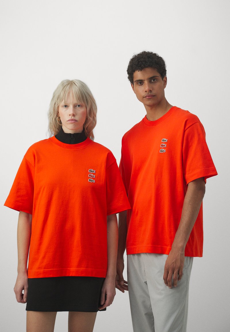 Lacoste UNISEX - T-Shirt basic - sunrise/orange - Zalando.de