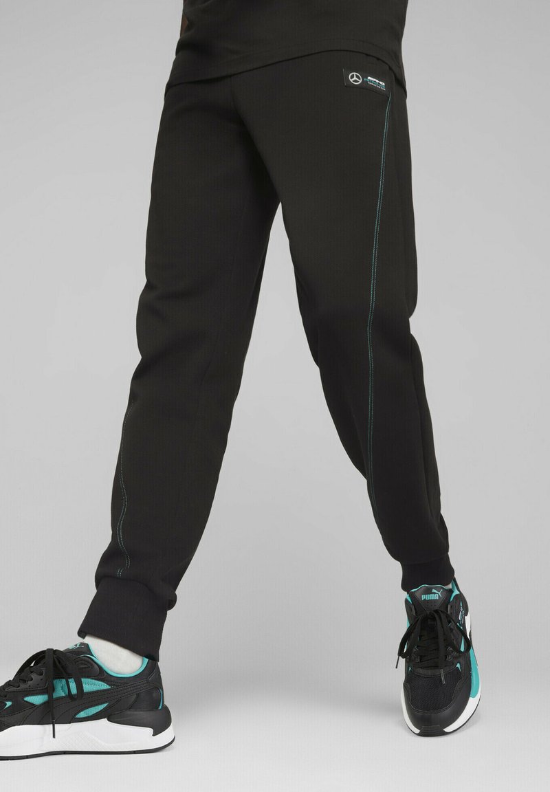 Puma AMG PETRONAS MOTORSPORT - Tracksuit bottoms - black - Zalando.ie
