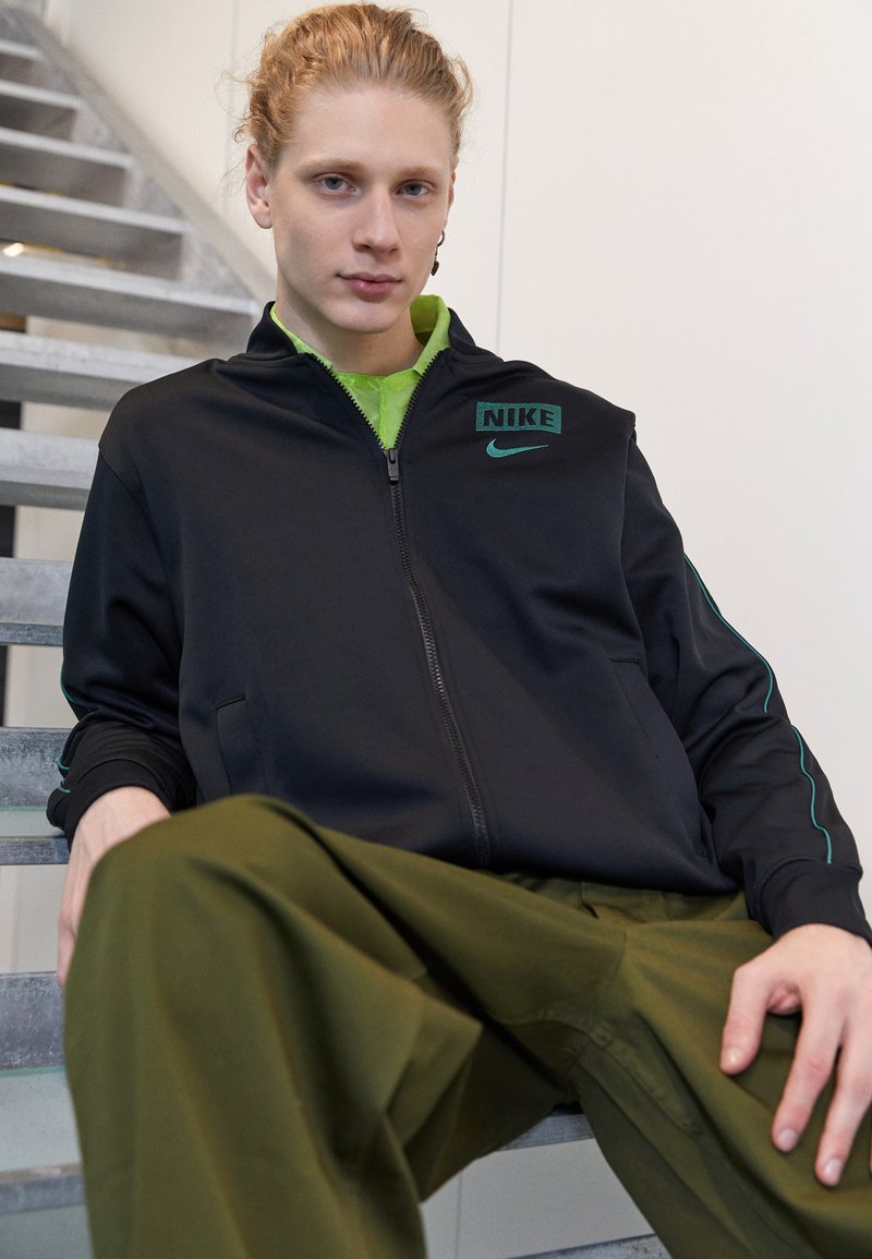 Nike Sportswear RETRO - Training jacket - black - Zalando.ie