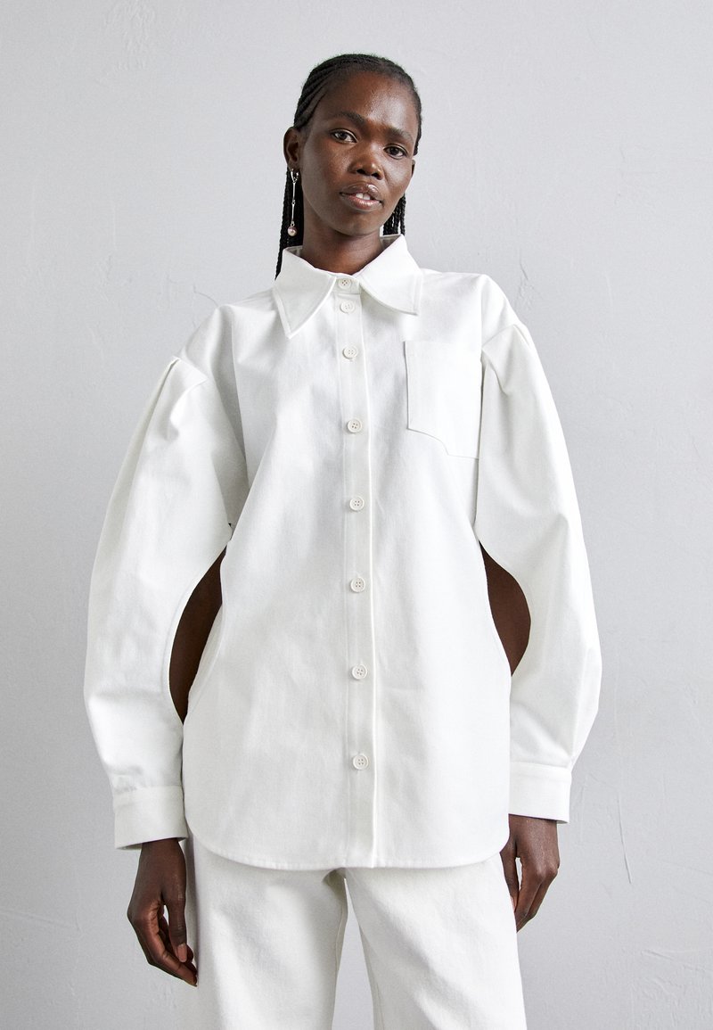 Ksenia Schnaider OVERSIZE BLOUSE WITH SIDE SLITS AND VOLUME SLEEVES ...