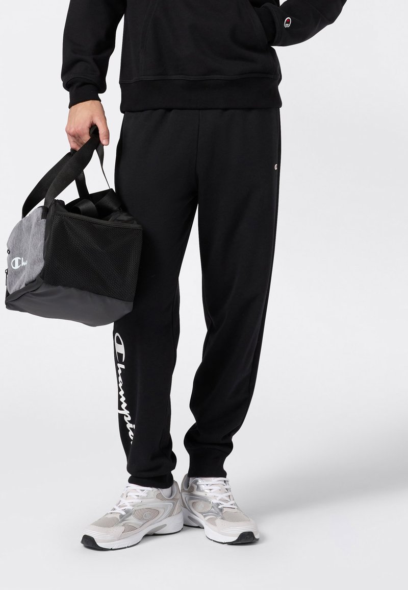 Champion SCRIPT SHOP - Tracksuit bottoms - black - Zalando