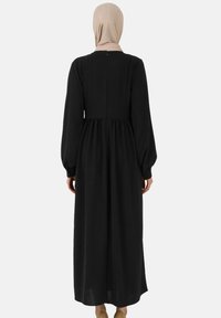 Modanisa Maxikleid - black/schwarz - Zalando.at