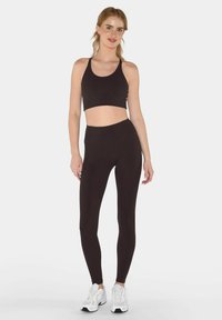 Girlfriend Collective FLOAT CLEO HALTER - Light support sports bra ...