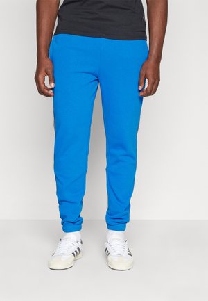 Umbro MONOGRAM TRACK PANT - Pantalon de survêtement - regal blue/bleu - ZALANDO.CH