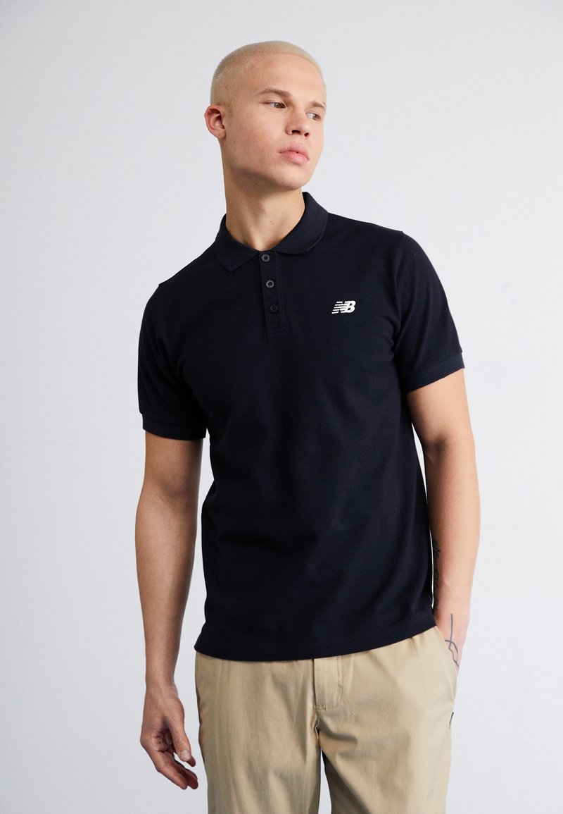 New Balance Polo shirt - black - Zalando