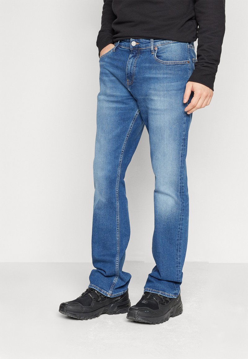 Tommy Jeans RYAN BOOTCUT - Jeans Bootcut - denim dark/dark-blue denim ...