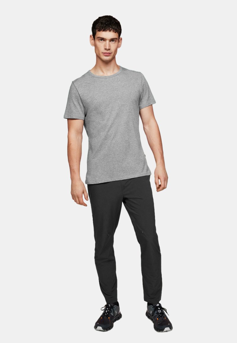 On MOVEMENT - Tracksuit bottoms - black - Zalando.ie