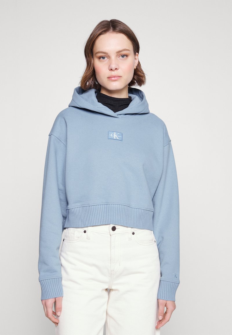 Calvin Klein Jeans Badge Wide Sleeves Crop Hoodie Sweatshirt