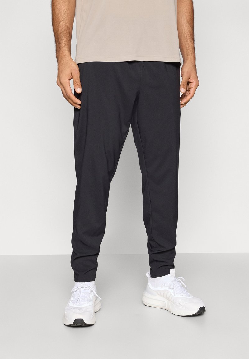 Under Armour VANISH TRAINING PANT - Tracksuit bottoms - black/white ...